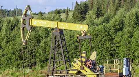 Oil pump on the forest background | Stock Video | Pond5