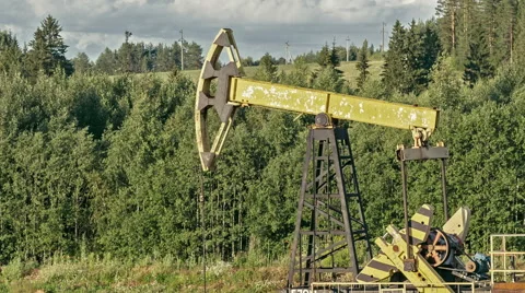 Oil pump on the forest background | Stock Video | Pond5