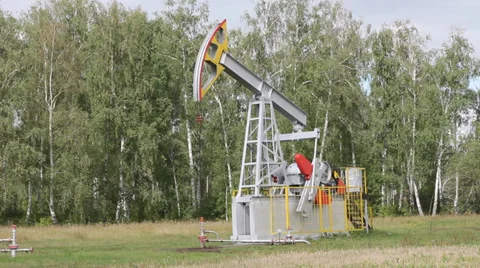 Oil pump working in the forest. Oil indu... | Stock Video | Pond5