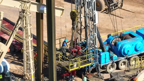 Oil rig fracking operation. Workers catc... | Stock Video | Pond5