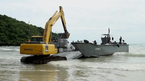 OIL SPILL BACK HOE HYDRAULIC EXCAVATOR L... | Stock Video | Pond5