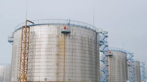 Oil storage tanks at the oil terminal. T... | Stock Video | Pond5