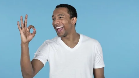 Okay Sign by African Man Isolated on Blu... | Stock Video | Pond5