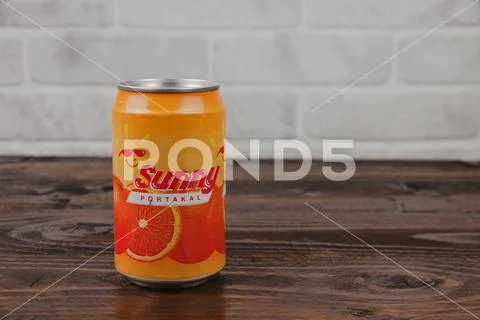 An old aluminium can of Sunny soft drink against the brick wall ...