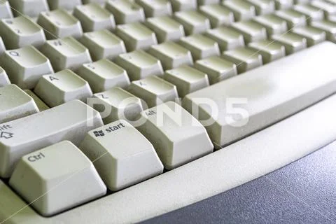 Old and dusty PC keyboard with a focus on the Windows / Start key ...