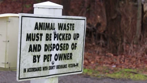 Old Animal Waste sign in public park | Stock Video | Pond5