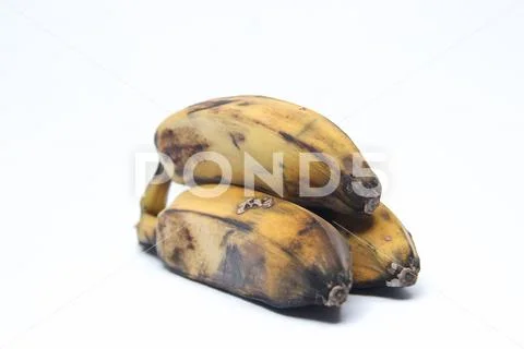 Photograph: Old banana isolated on white background #140090677