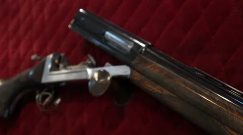Old beautiful rifle on a red fabric back... | Stock Video | Pond5