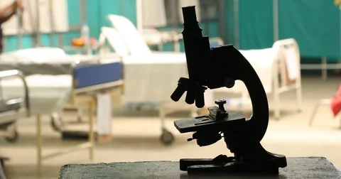Old black Microscope in laboratory | Stock Video | Pond5