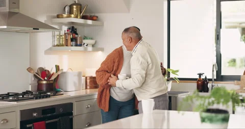 Old couple, hug in kitchen with coffee a... | Stock Video | Pond5