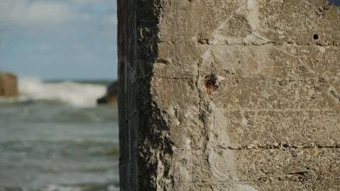 Old destroyed bunkers from ww2 at the be... | Stock Video | Pond5