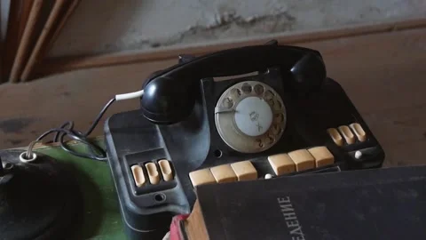 Old Dial Telephone And Books On The Desk... | Stock Video | Pond5