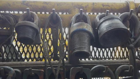 Old drill pipe lifting cap hanging on th... | Stock Video | Pond5