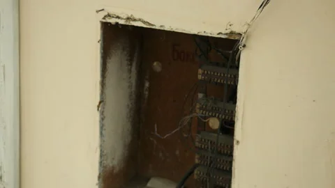 Old electric shield in wall of old house... | Stock Video | Pond5