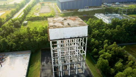 Old elevated water tank structure surrou... | Stock Video | Pond5