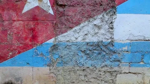 An old faded mural of the Cuban flag. | Stock Video | Pond5