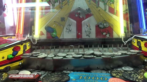Old fashioned arcade money coin pushing ... | Stock Video | Pond5