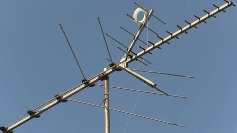 Old fashioned TV antenna on house roof f... | Stock Video | Pond5