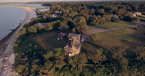 Old Field Point Lighthouse sunset flyawa... | Stock Video | Pond5