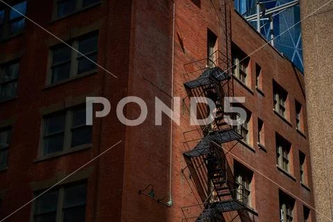 Old fire escape on an old brick wall. American vintage style. Stock ...