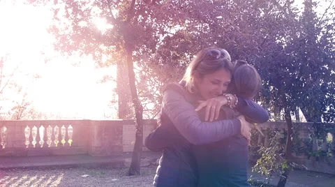 old friends hugging each other in a park... | Stock Video | Pond5