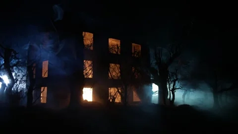 Old house with a big windows and zombies... | Stock Video | Pond5