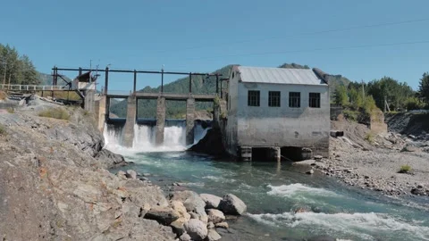 An old hydroelectric power station on ri... | Stock Video | Pond5