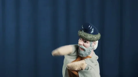 Old man hand puppet shacking head, warms... | Stock Video | Pond5