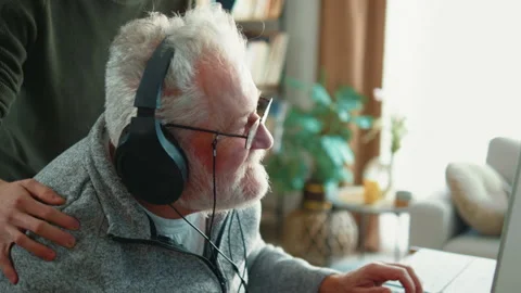 Old man playing video game on computer s... | Stock Video | Pond5