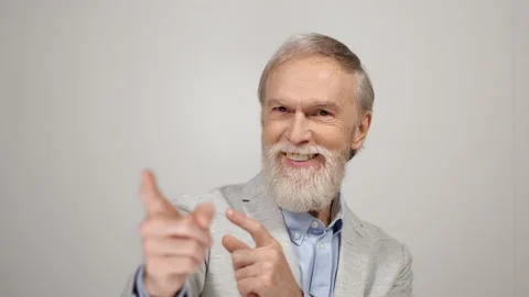 Old man pointing to camera inside. Cheer... | Stock Video | Pond5