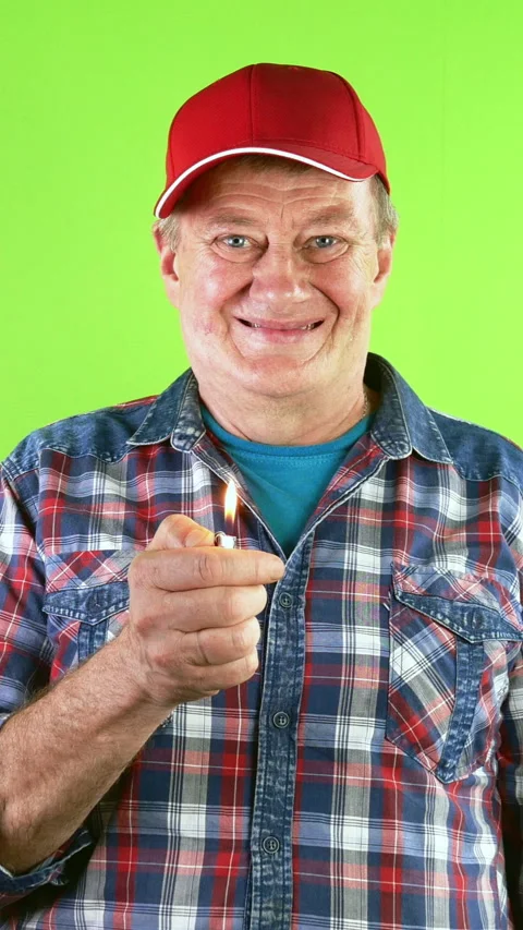 Old man in red baseball cap lighting gas... | Stock Video | Pond5