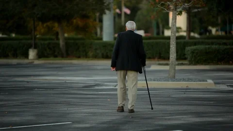 Old man. Walking alone. Lost in parking ... | Stock Video | Pond5