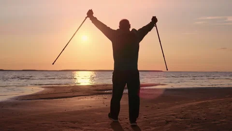 Old man winner with Scandinavian walking... | Stock Video | Pond5