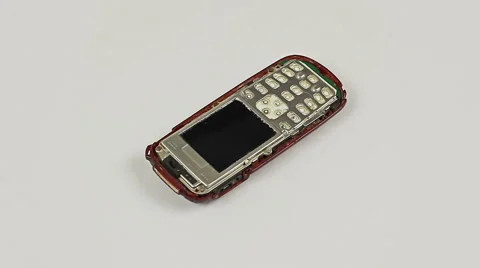 Old mobile phone isolated and rotates on... | Stock Video | Pond5