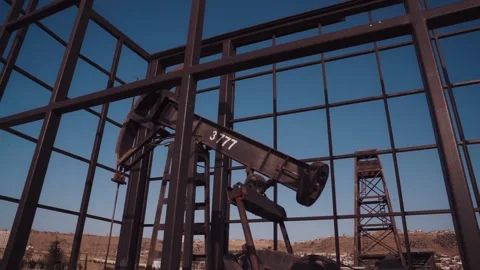 the old oil rig is working, extracting o... | Stock Video | Pond5