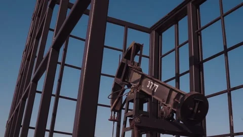 the old oil rig is working, extracting o... | Stock Video | Pond5