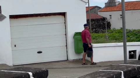 Old Portuguese aged man with bucket walk... | Stock Video | Pond5