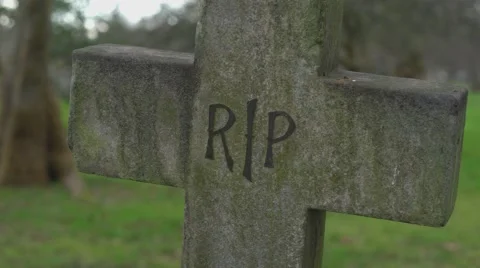 Old Rest in piece crucifix on a cemetery... | Stock Video | Pond5