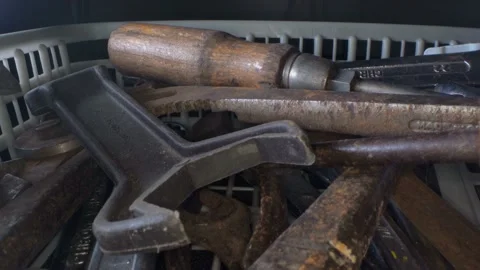 Old rusty and worn tools lying jumbled i... | Stock Video | Pond5