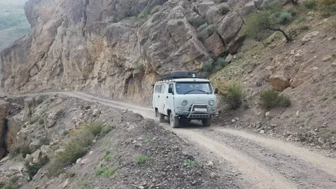 Old Soviet UAZ Off-road Van Moving on Du... | Stock Video | Pond5