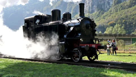 Old steam locomotive train drive on rail... | Stock Video | Pond5