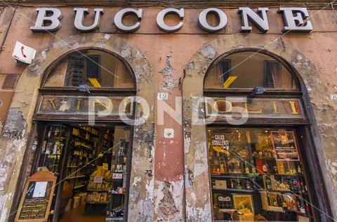 Old storefront and window display with chipped paint and fainted ...