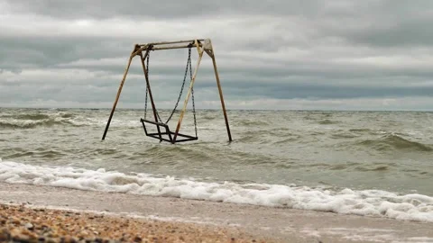 An old swing on rusty chains stands in a... | Stock Video | Pond5
