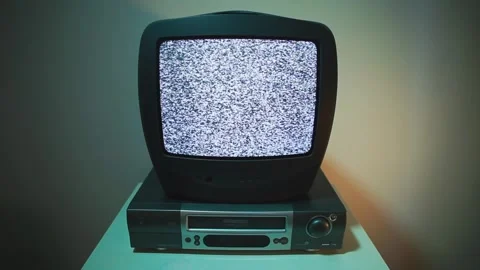 Old TV and VHS video recorder, a man ins... | Stock Video | Pond5