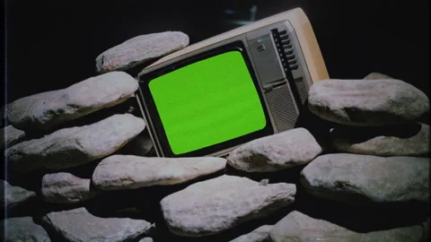 Old TV Green Screen Buried By Rocks Aban... | Stock Video | Pond5
