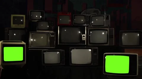 Old TV Monitors Piled Up With Two Green ... | Stock Video | Pond5