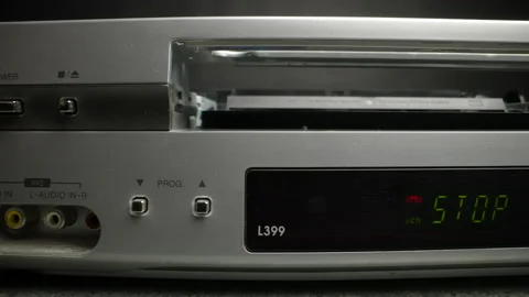 Old VCR with VHS cassette. Dolly shot. C... | Stock Video | Pond5