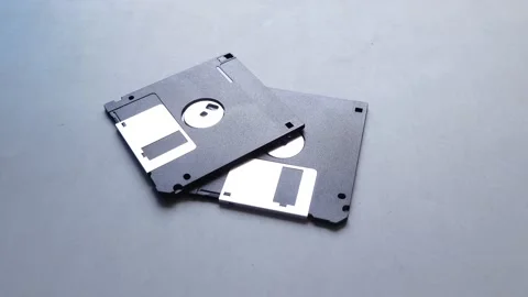 an old vintage floppy disk on a gray bac... | Stock Video | Pond5