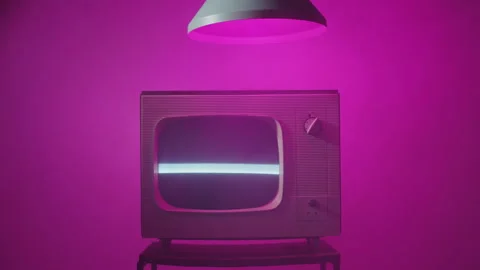 Old vintage television on pink neon back... | Stock Video | Pond5