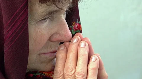 old woman praying: catholic elderly poor... | Stock Video | Pond5